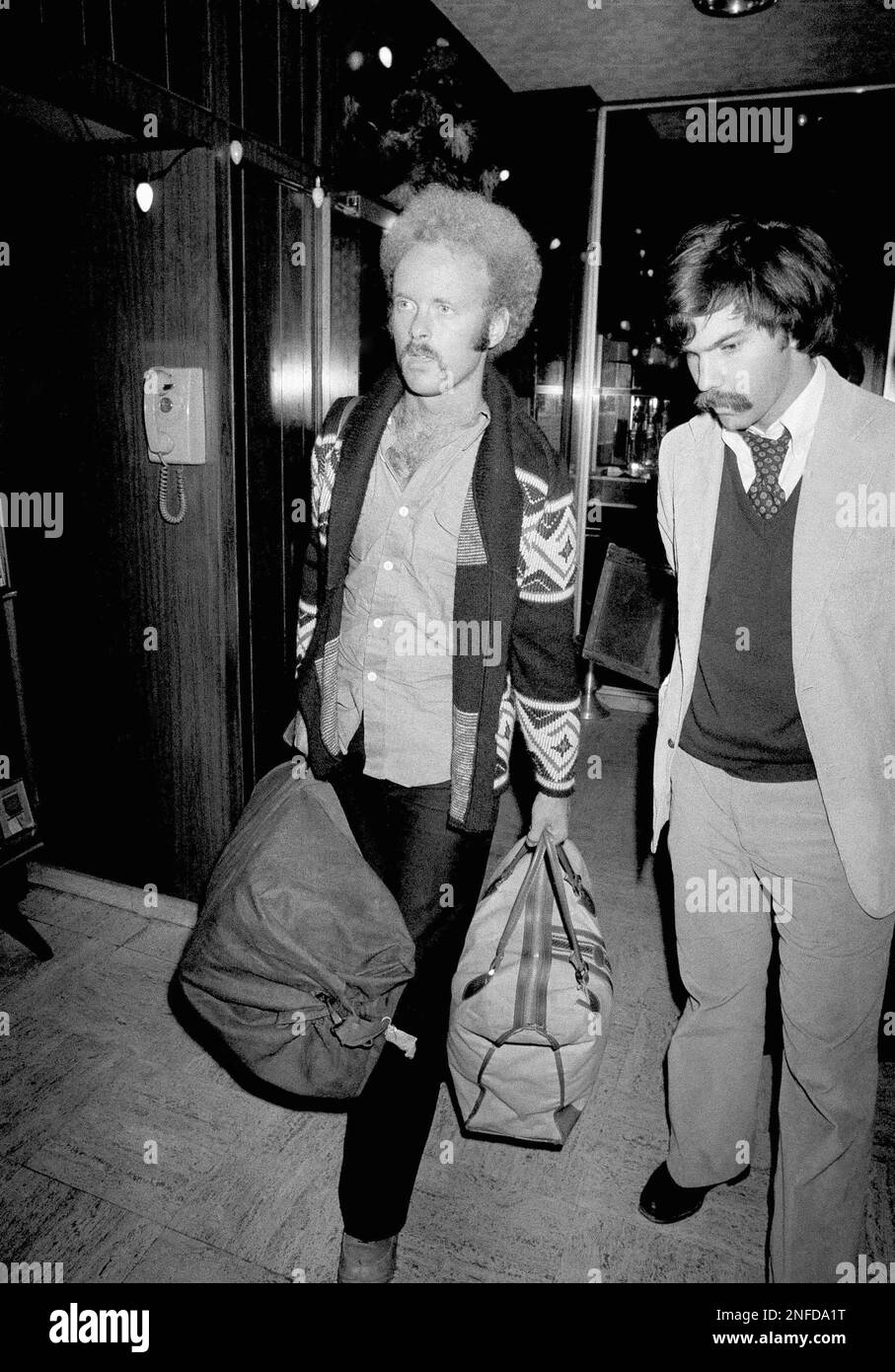 Timothy Glen Jones, left, walks past a reporter as he arrives at New ...
