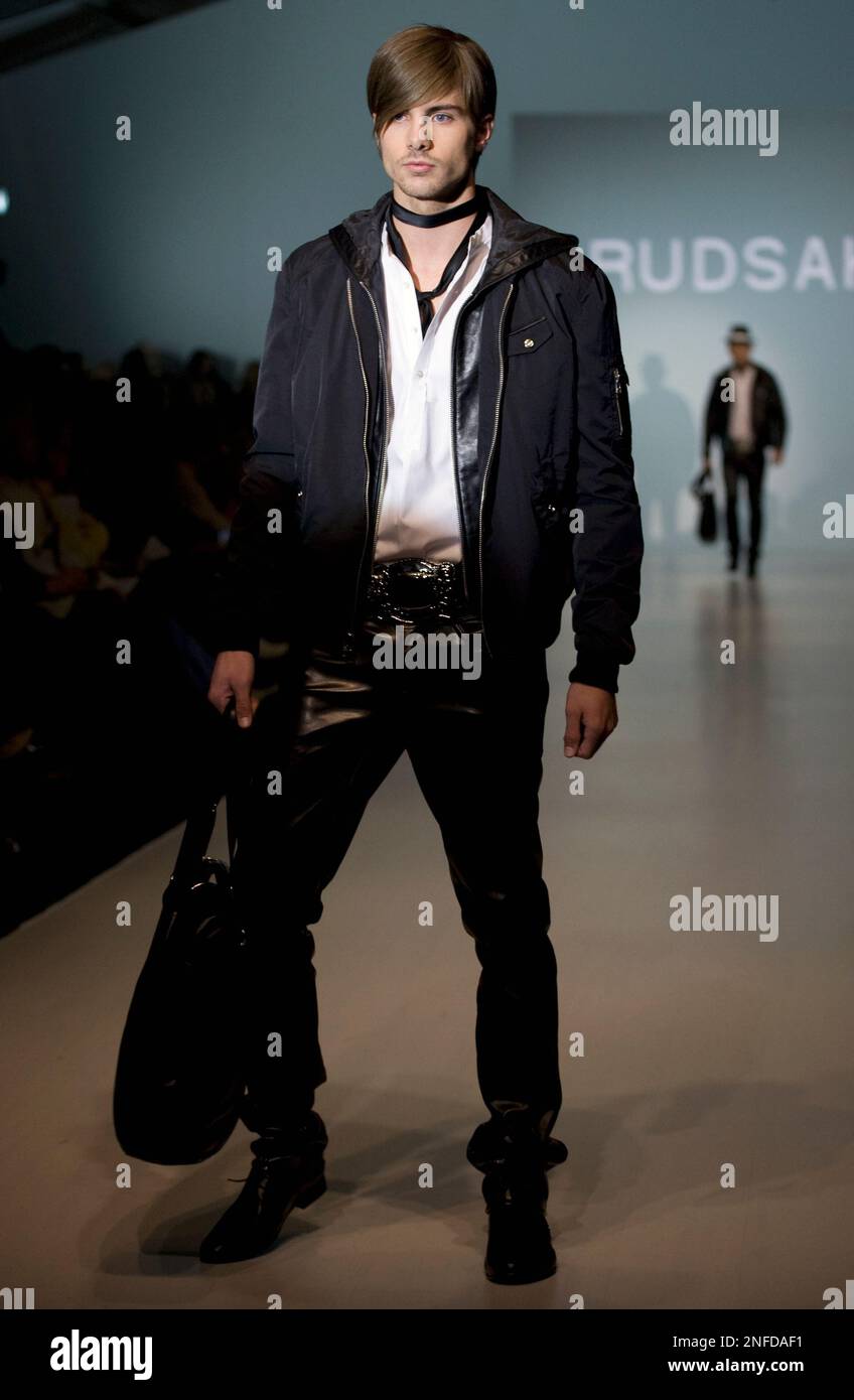 A model wears an outfit on the runway in the "Rudsak" show, part of ...