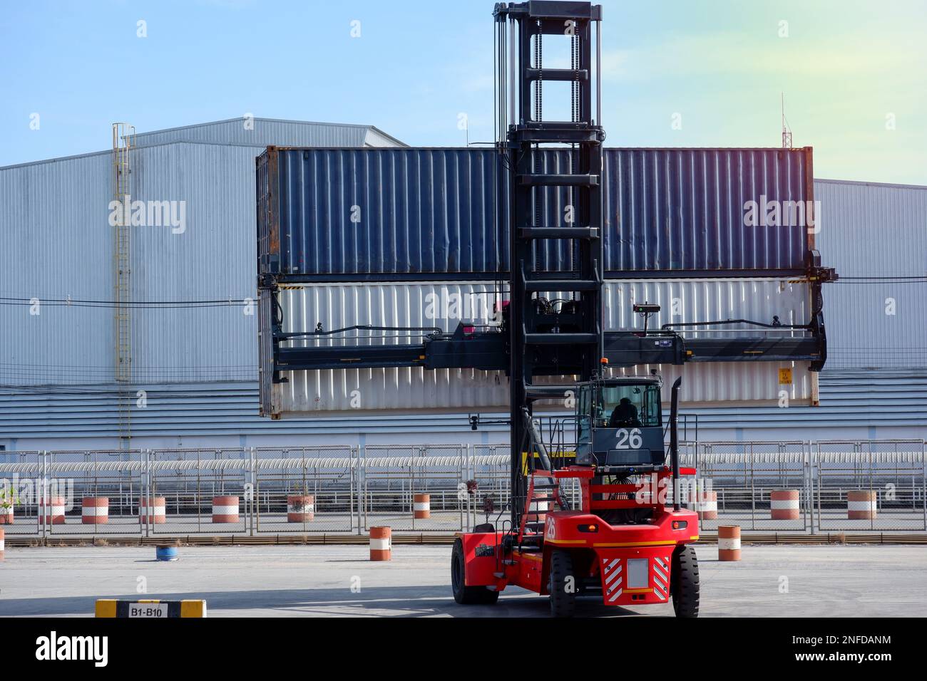 forklift truck Container boxes in a logistics yard with a stack of ...