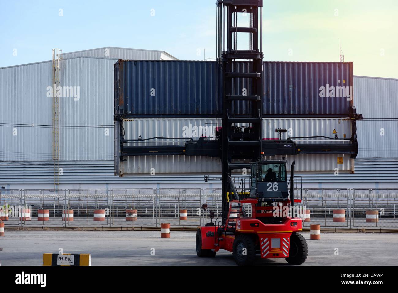 forklift truck Container boxes in a logistics yard with a stack of ...