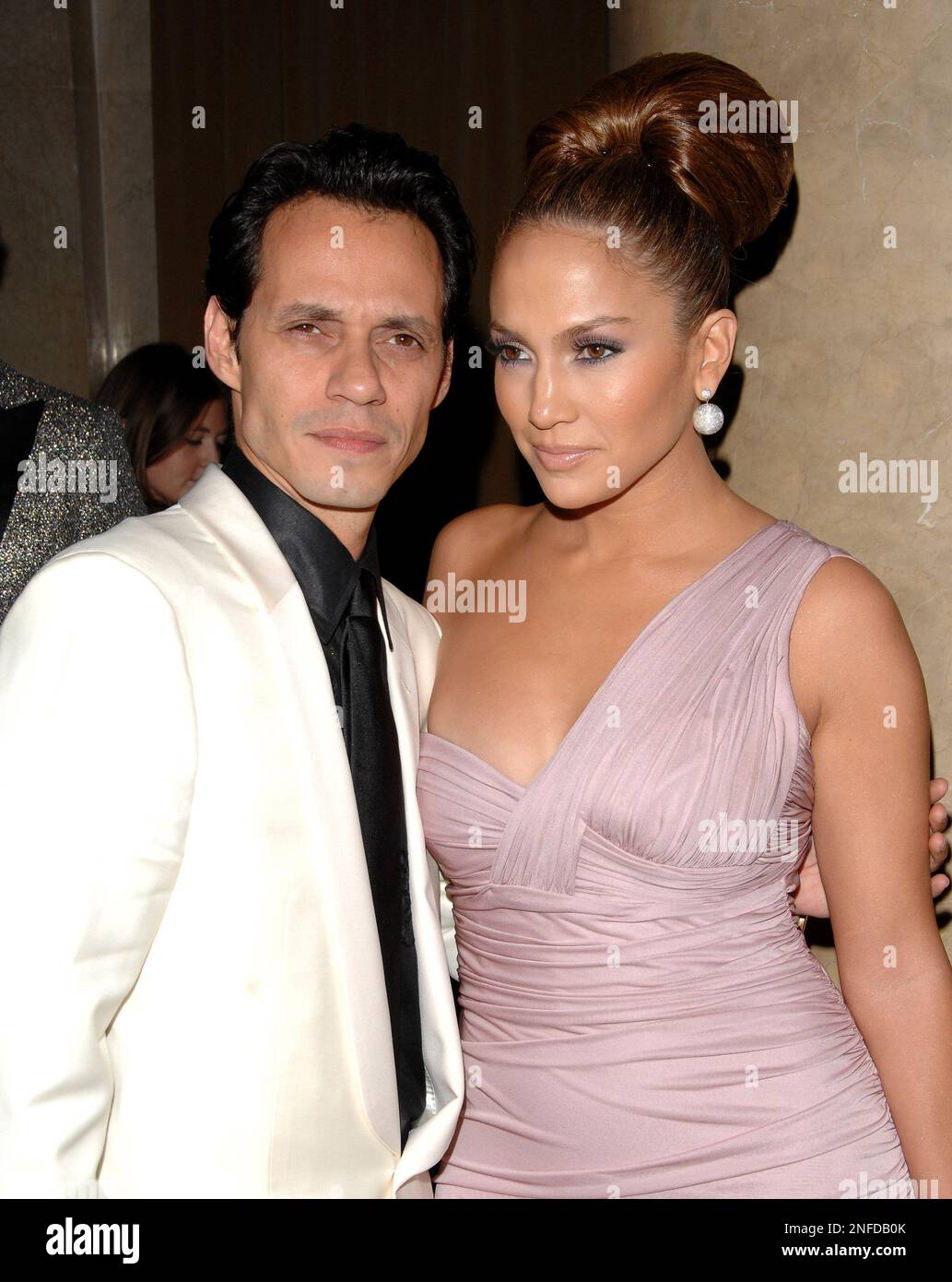 Actress Jennifer Lopez and Marc Anthony arrive at the Fashion Group's ...