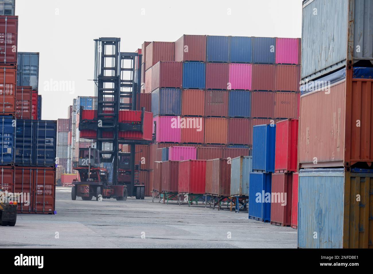 forklift truck Container boxes in a logistics yard with a stack of ...