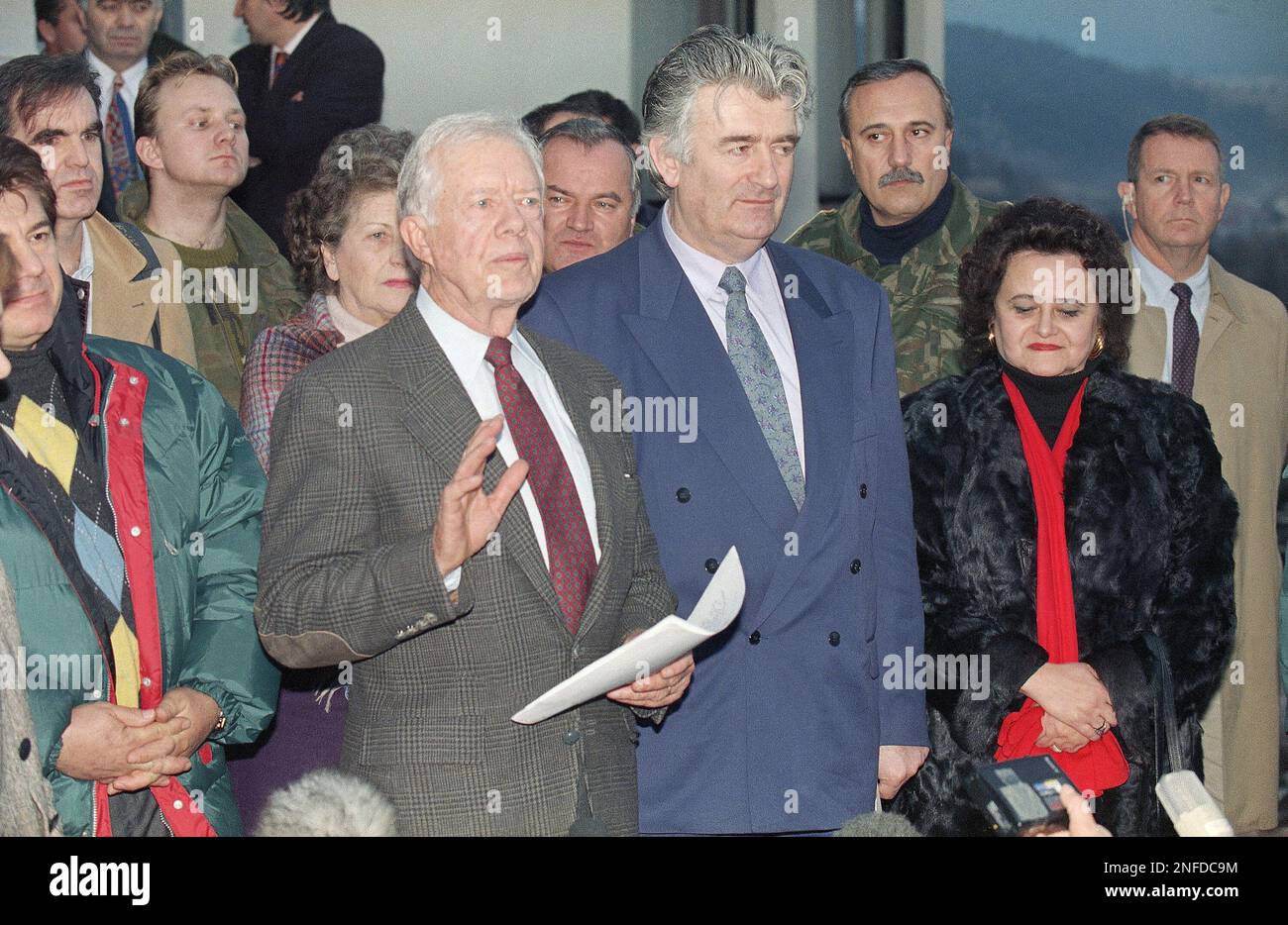 Former U.S. President Jimmy Carter, left, speaks to reporters while ...