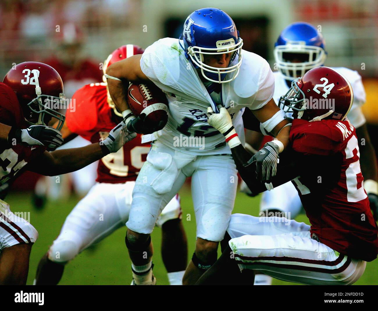 Alabama defensive back Marquis Johnson (24) tackles Kentucky wide ...