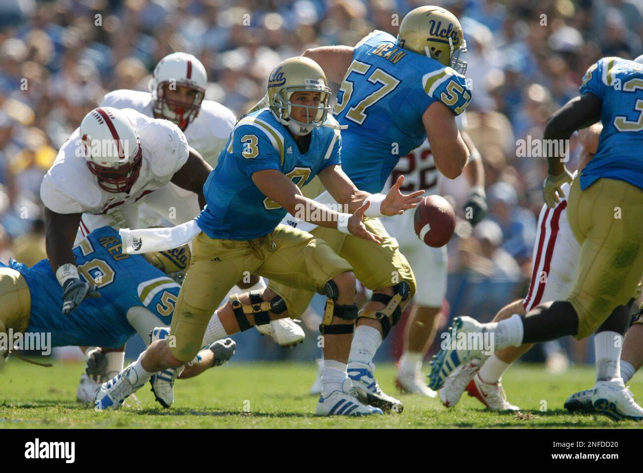 UCLA quarterback Kevin Craft tosses the ball off against Stanford ...
