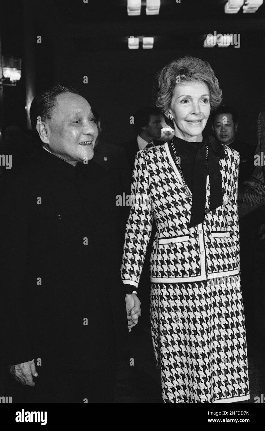 Chinese leader Deng Xiaoping, left, and First Lady Nancy Reagan hold ...