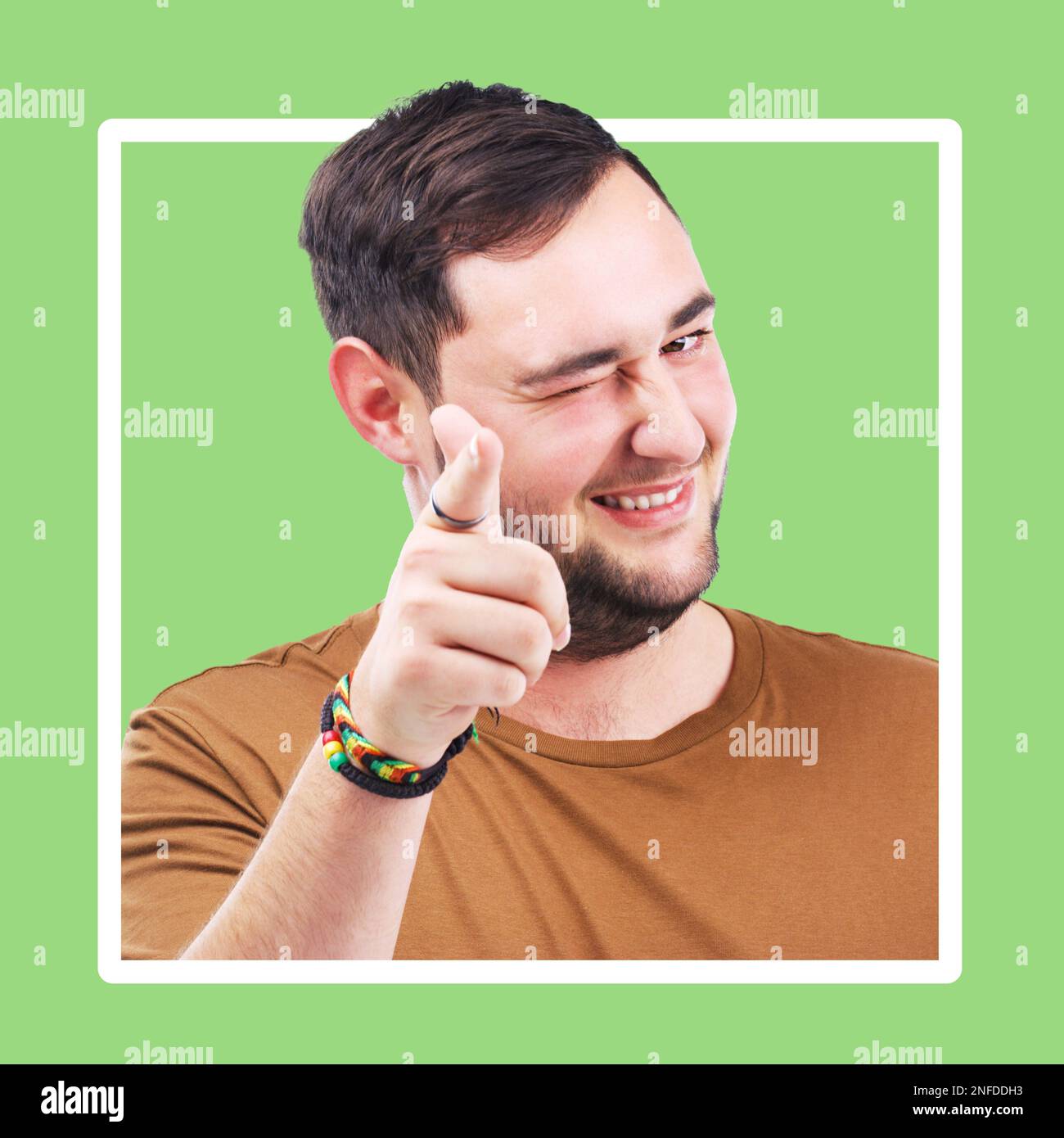 Winking, pointing and smile with portrait of man for winner, emoji and ...