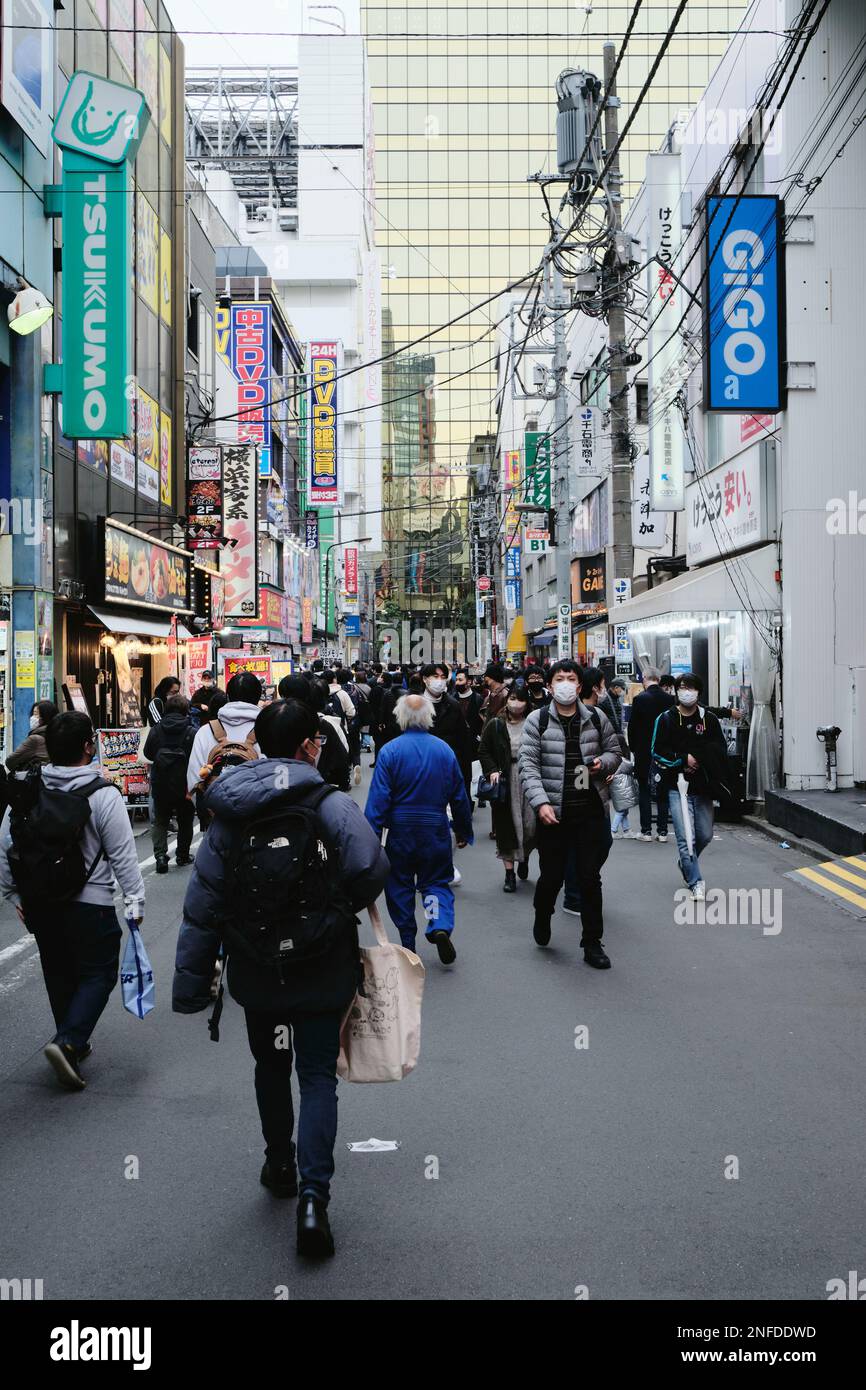 Crowds wandering through a backstreet in Akihabara in Tokyo, Japan ...