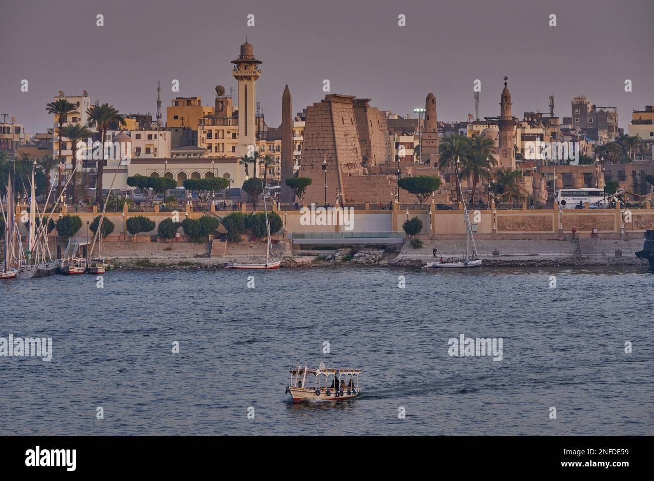 Luxor ,Egypt sunset shot from west bank showing Nile river with ...