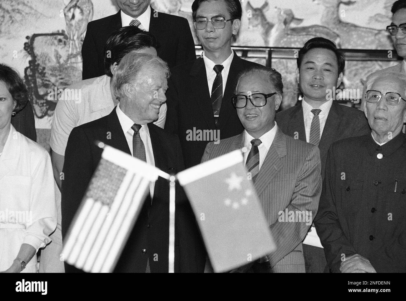 Framed by the flags of their two countries, former U.S. President Jimmy ...