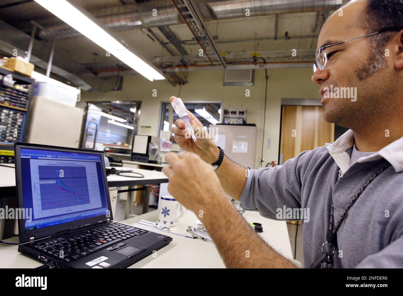 Lead test technician K.C. Puaa gets ready to test the injection stream ...