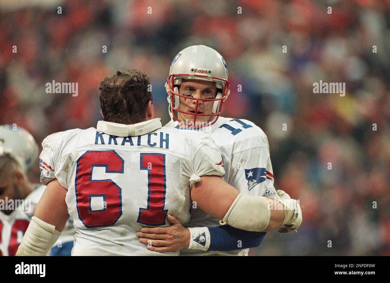 New England Patriots quarterback Drew Bledsoe is hugged by guard Bob ...