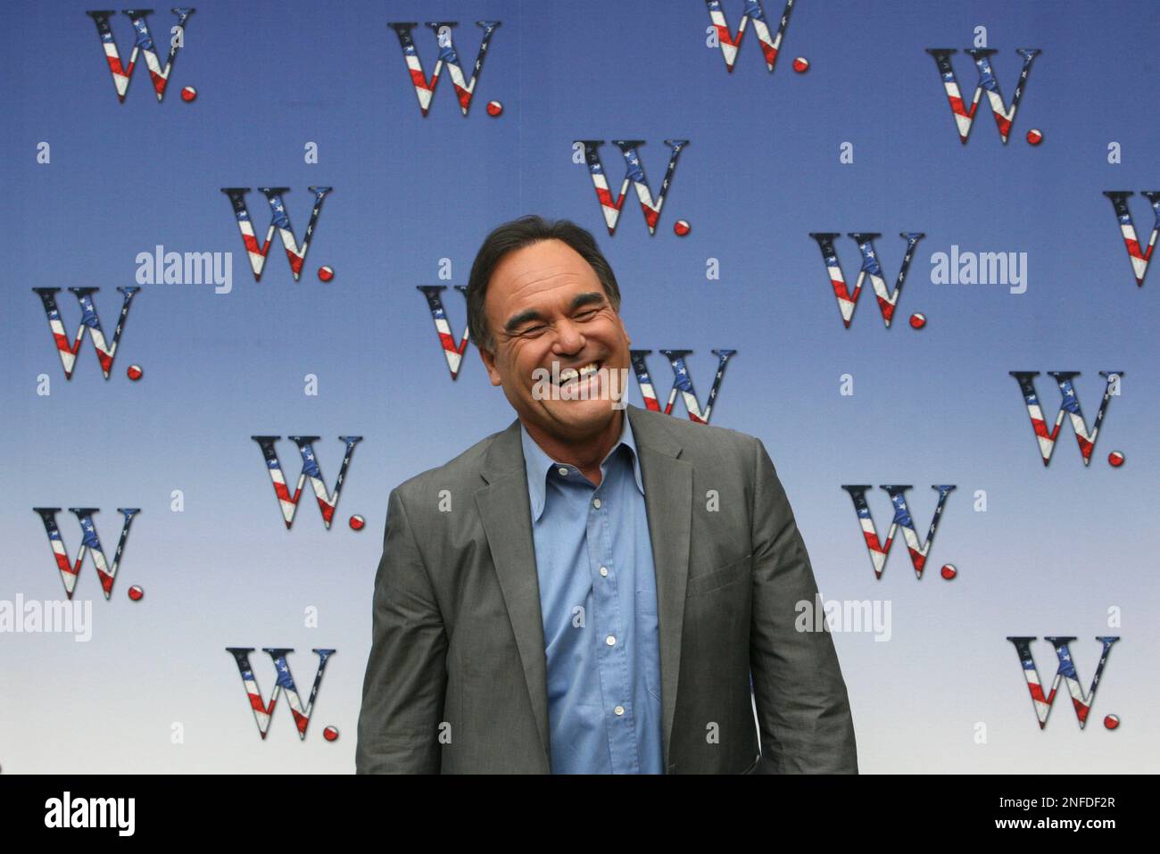 U.S. film director Oliver Stone smiles during a photocall as he ...