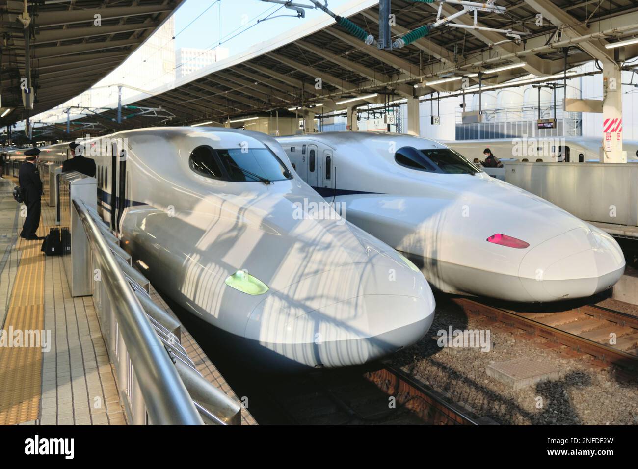 Two bullet trains (shinkansen) parked at Tokyo Station in Tokyo, Japan ...