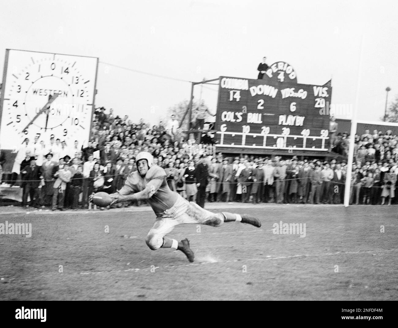 Columbia's brilliant end Bill Swiacki reaches out to make a diving ...