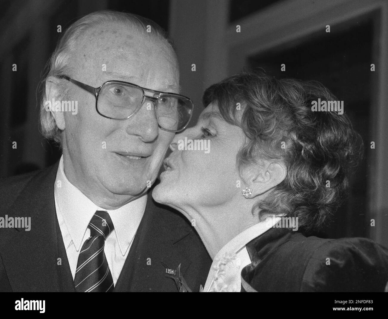 West German actor Martin Held is kissed by his wife Lore Hartling ...