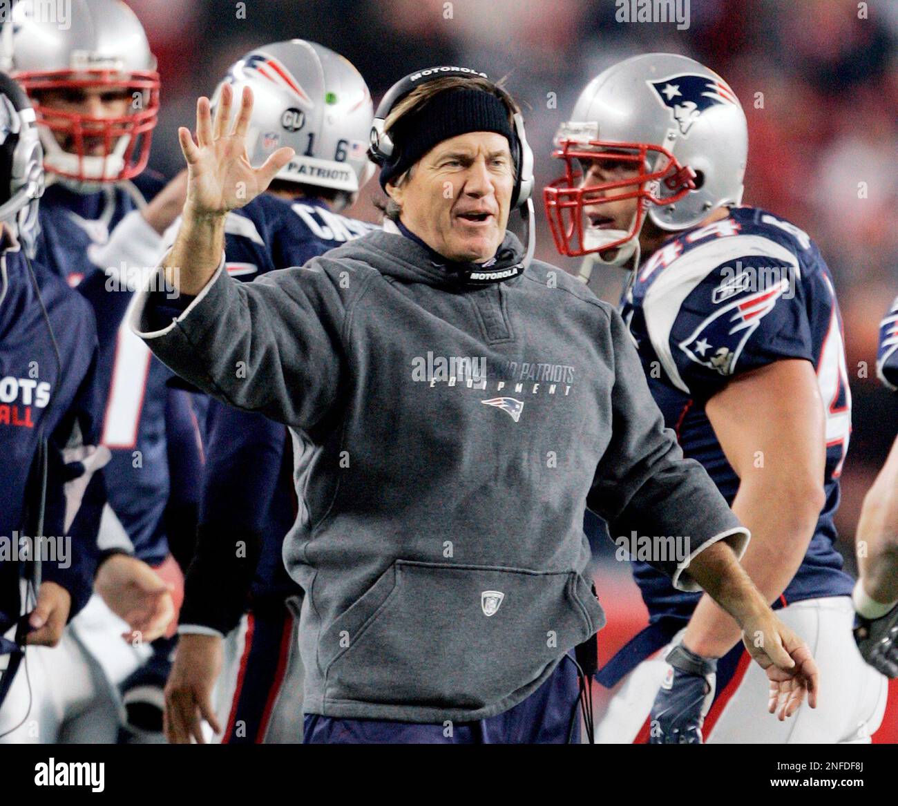 New England Patriots head coach Bill Belichick, center, celebrates a ...