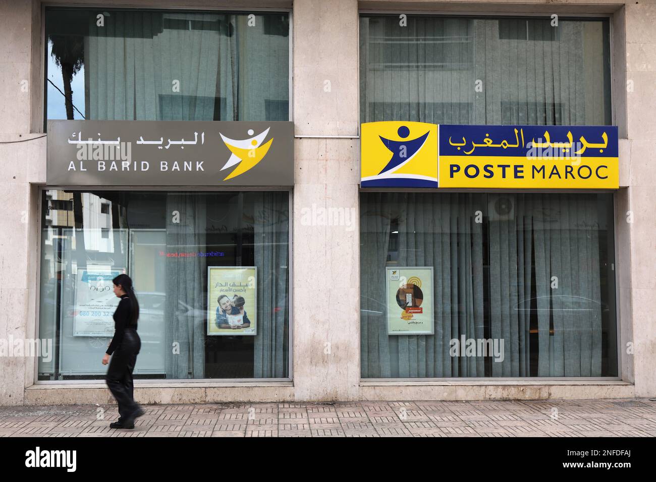 CASABLANCA, MOROCCO - FEBRUARY 22, 2022: Person walks by post office of ...