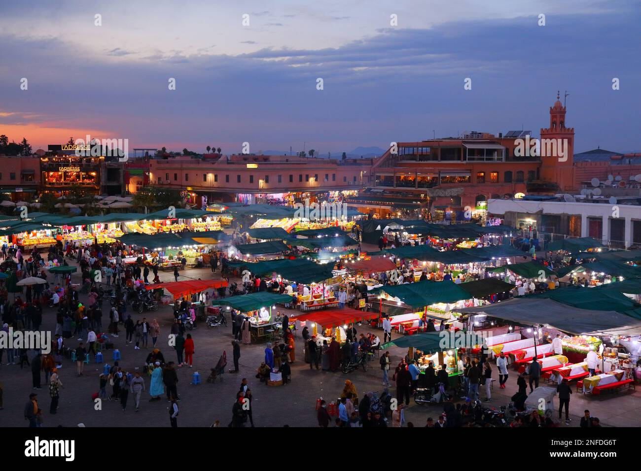 MARRAKECH, MOROCCO - FEBRUARY 20, 2022: People visit Jemaa el-Fnaa ...