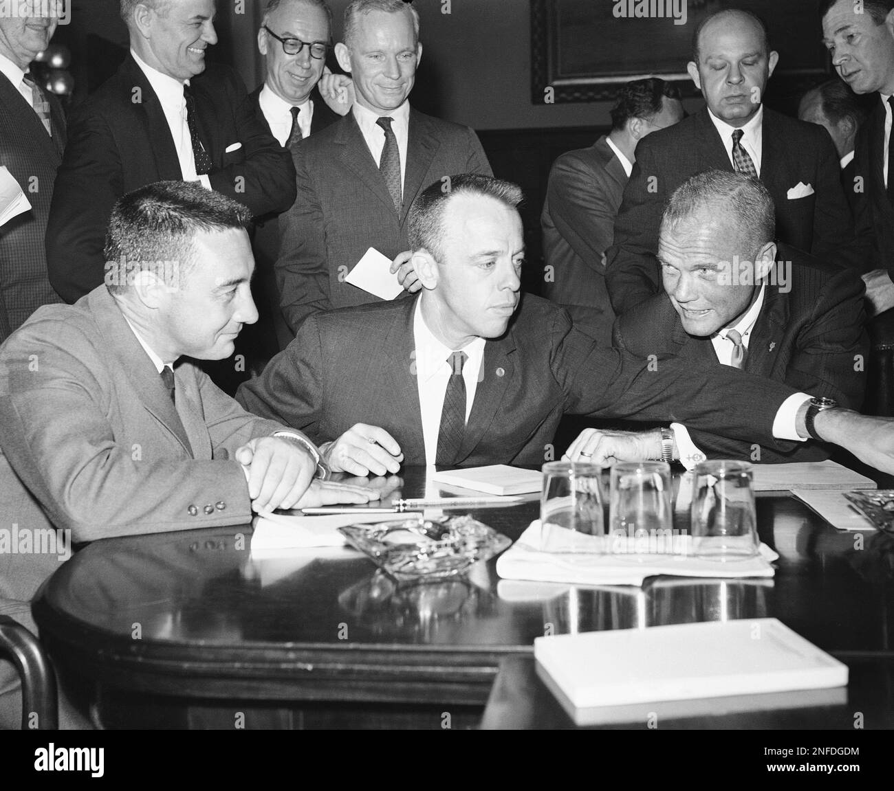Three of Americas seven astronauts, including John Glenn, right, who ...