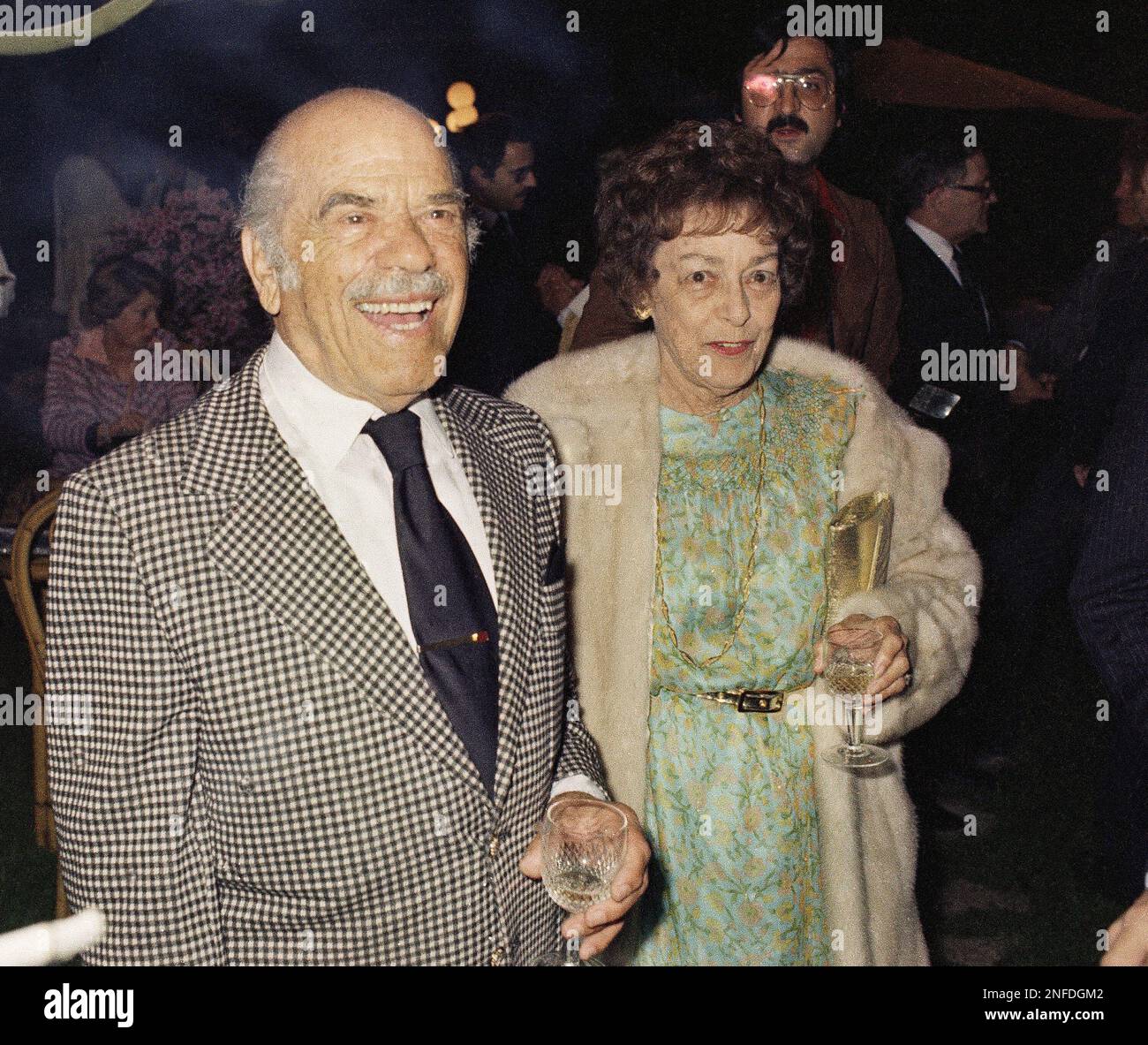 Director Frank Capra, left, with his wife Lou Capra, at a party in ...