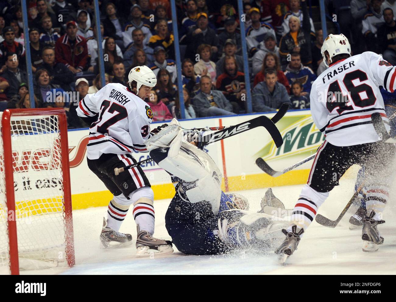St. Louis Blues' goalie Manny Legace, center, makes a save against ...