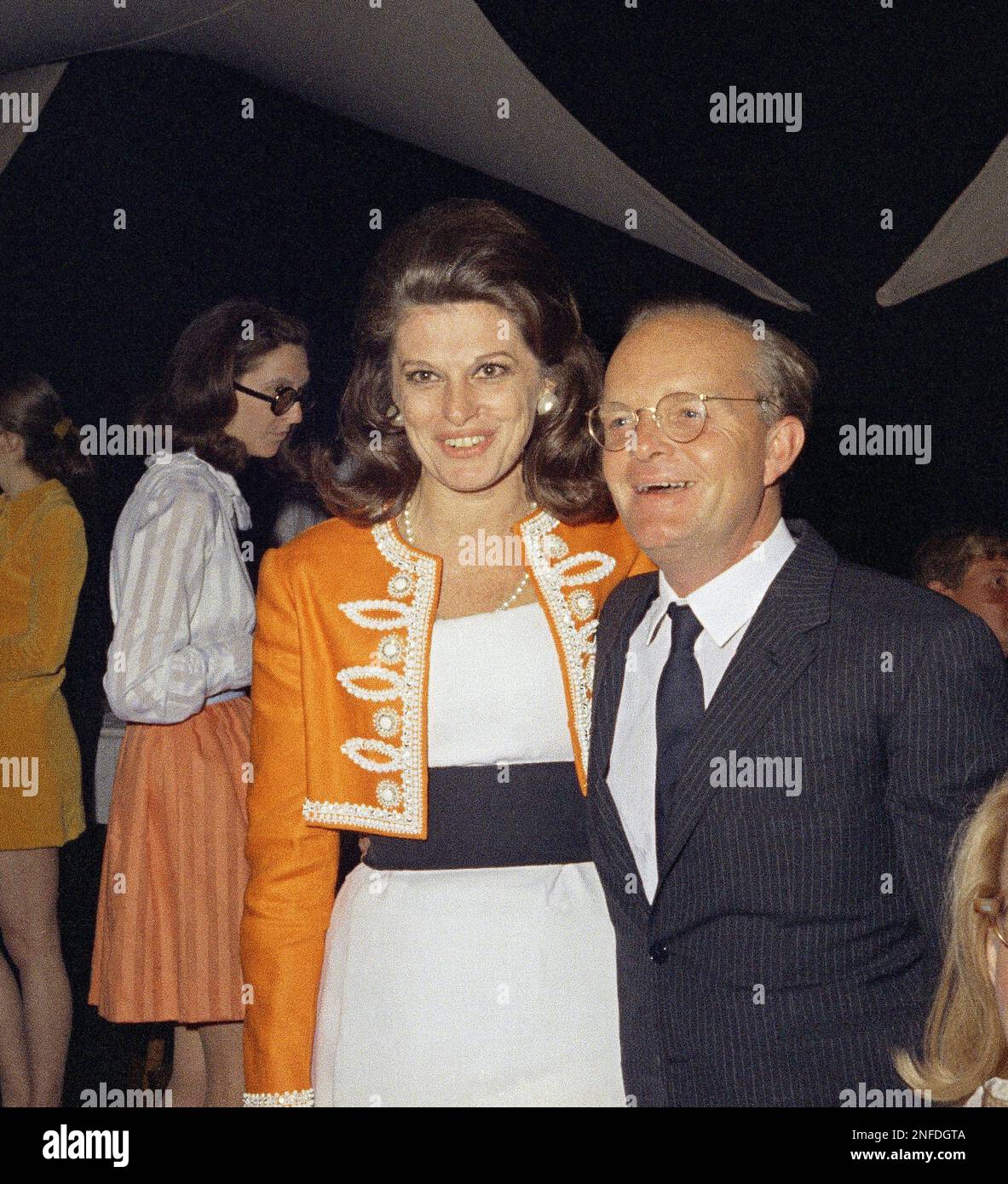 Author Truman Capote, right, standing next to Marion Javits, wife of ...