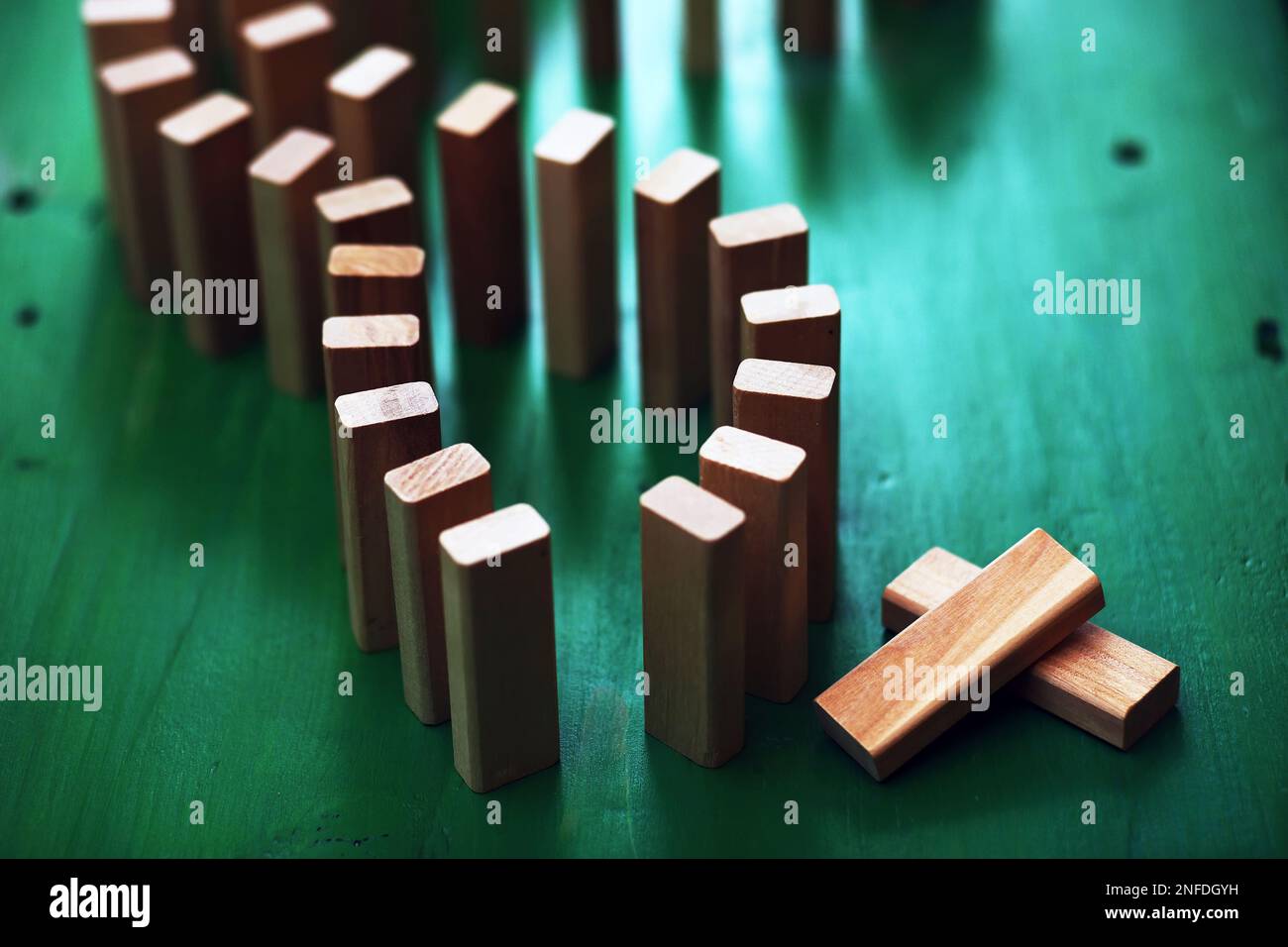 Stick wood block standing on stacked square wood blocks, abstract ...