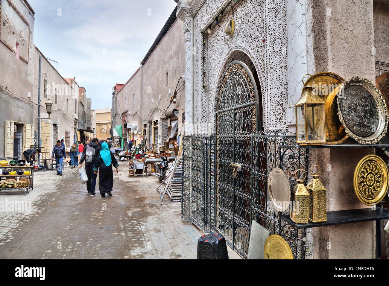 MARRAKECH, MOROCCO - FEBRUARY 20, 2022: People visit souk in medina ...