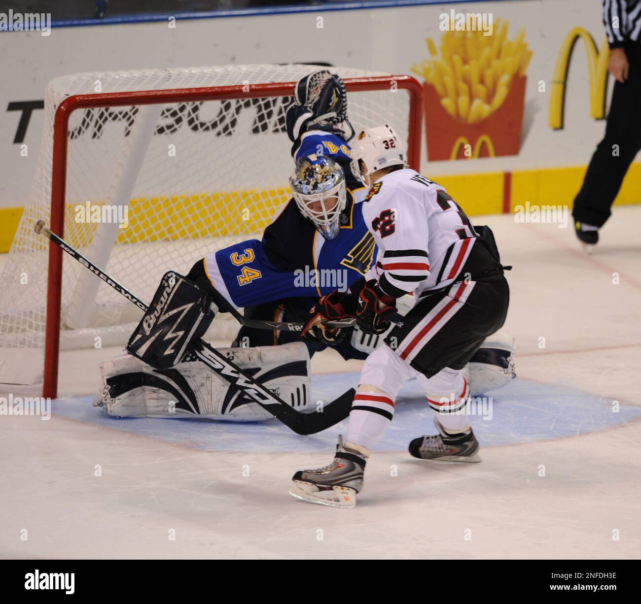 St. Louis Blues goalie Manny Legace (34) blocks a shot by Chicago ...
