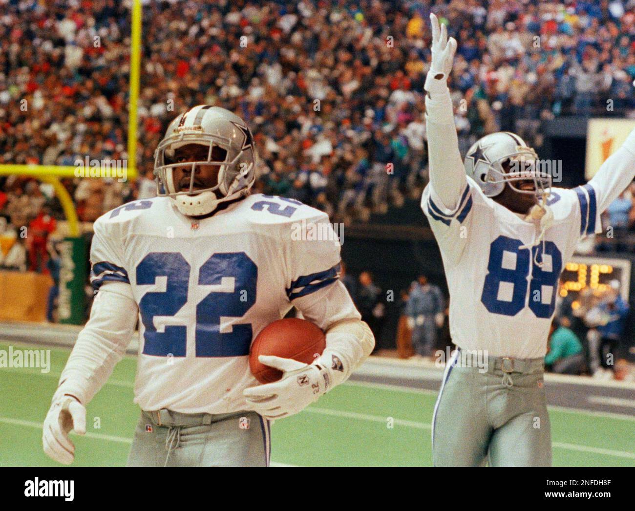 Dallas Cowboys' running back Emmitt Smith (22) walks off the field after scoring in the third ...