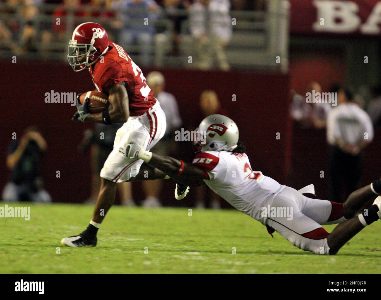 Alabama running back Glen Coffee (38) breaks a diving tackle against ...