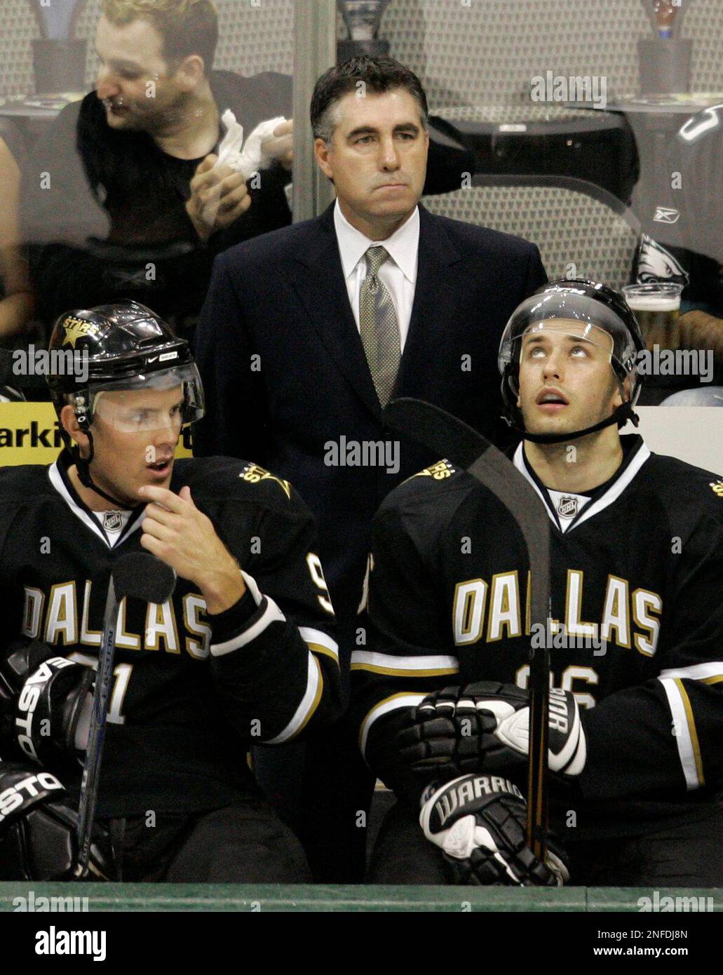 Dallas Stars coach Dave Tippett, center rear, stands behind Brad ...
