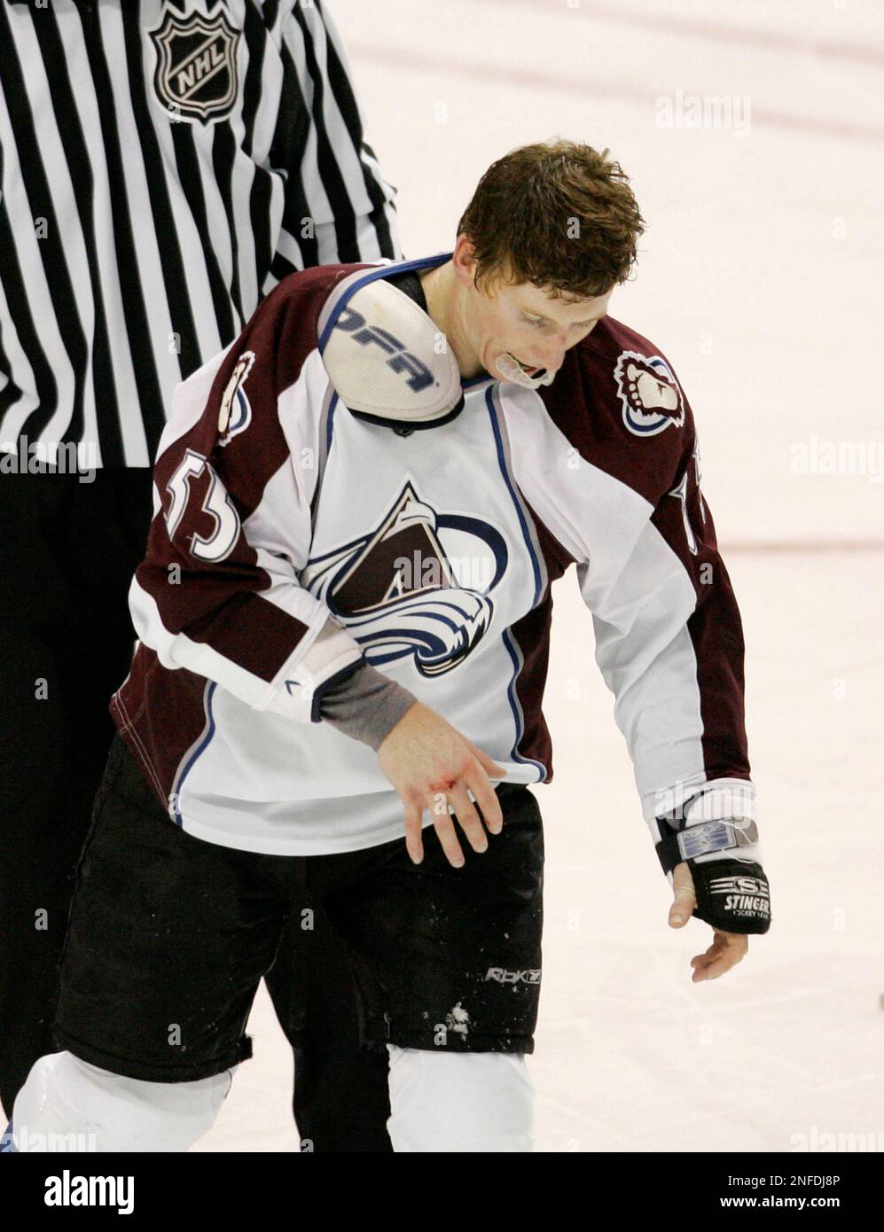 Colorado Avalanche left wing Cody McLeod (55) looks down at his ...