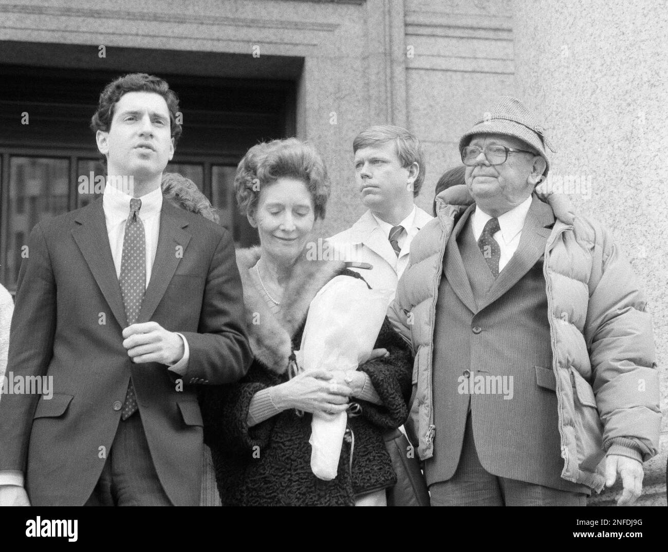 Col. Gains Hawkins, left, and his wife, carrying flowers, leave the U.S ...