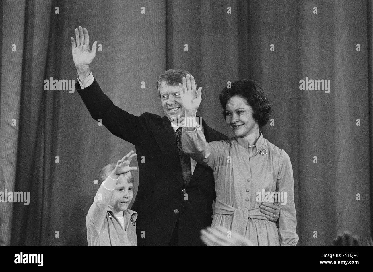 President-elect Jimmy Carter and Rosalynn Carter wave to supporters ...