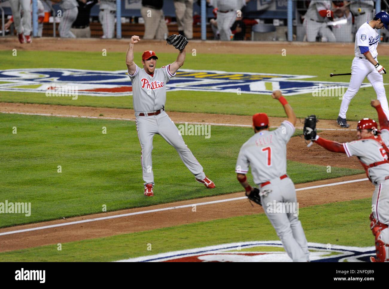 Philadelphia Phillies pitcher Brad Lidge, left, cheers with teammates ...