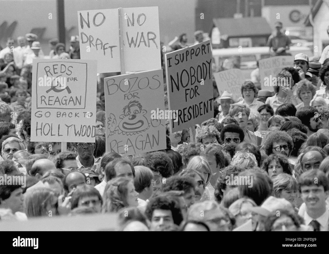 Spectators at a Jimmy Carter rally hold up signs at the President's ...