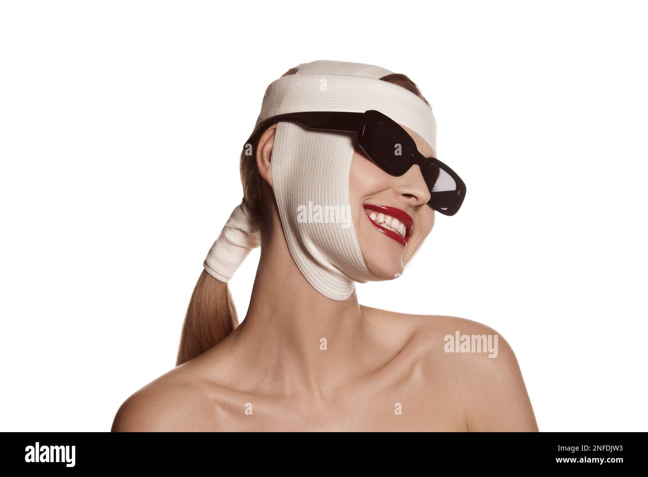 Female face bandaged with medical bandages and sunglasses with human ...