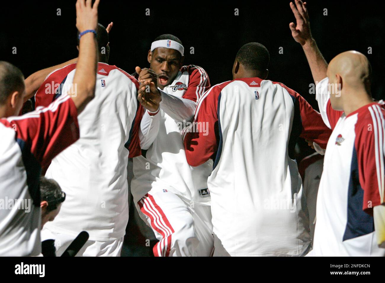 Cleveland Cavaliers' LeBron James, center, is introduced before an NBA ...