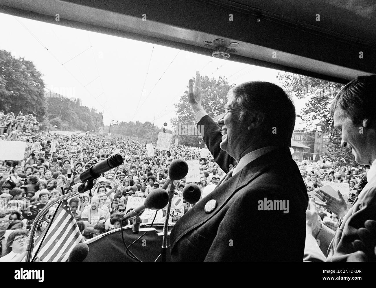 Presidential candidate Jimmy Carter waves from the rear of a train to a ...