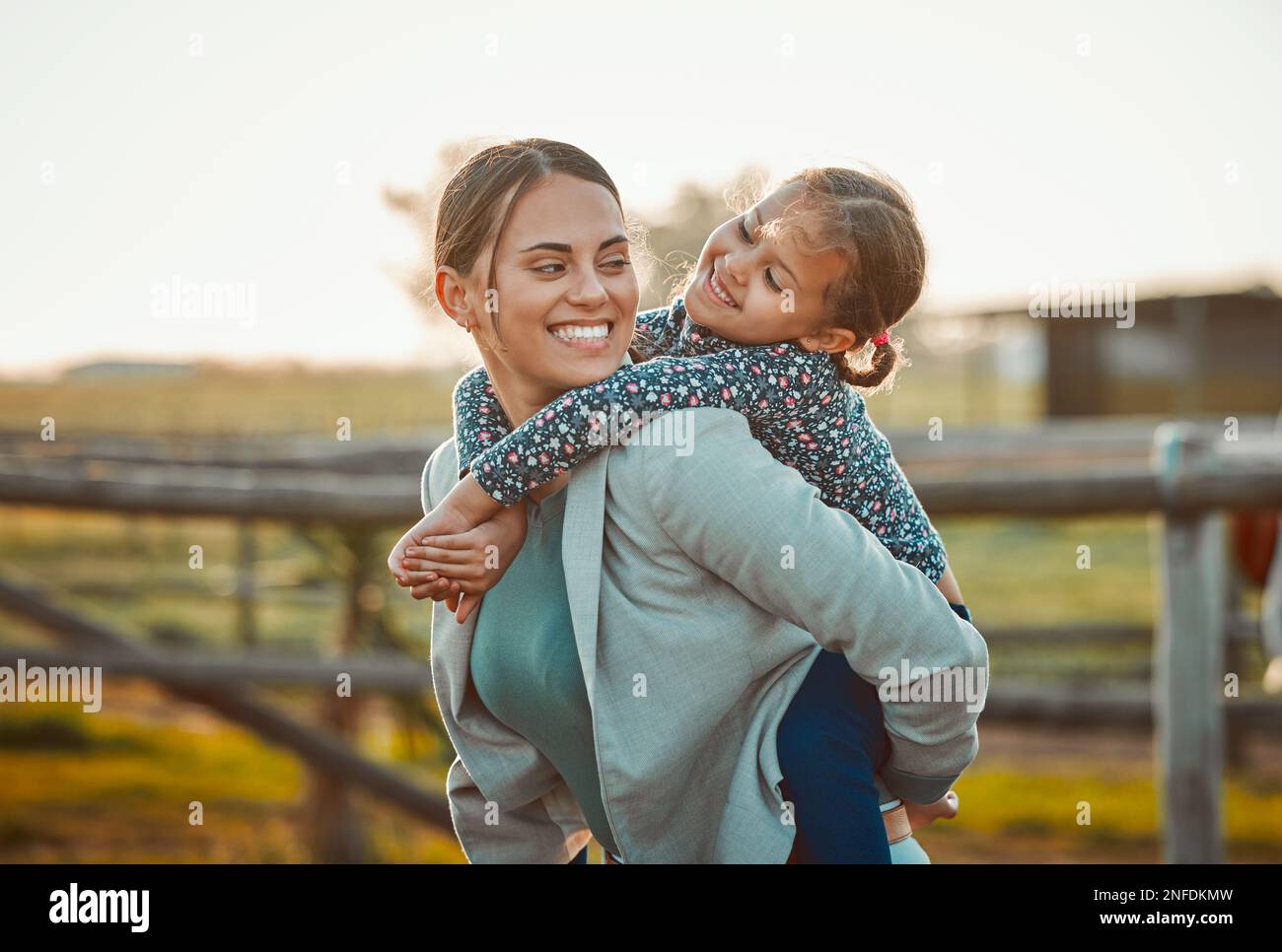 Mother, young girl and hug of a kid piggy back fun and parent care ...