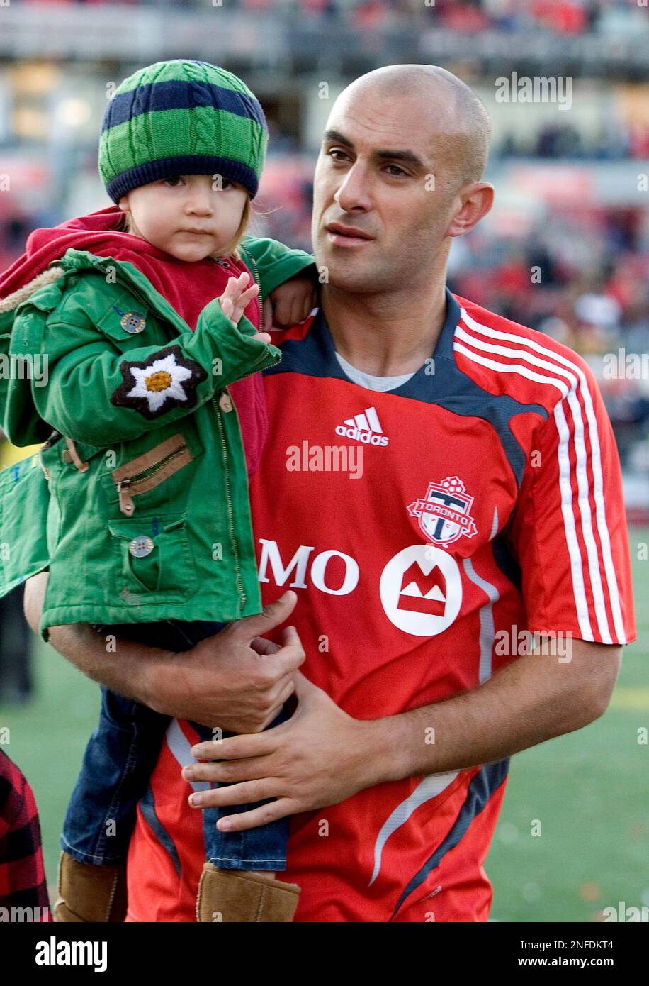 Toronto FC's Danny Dichio carries his two-year-old daughter Alessia ...