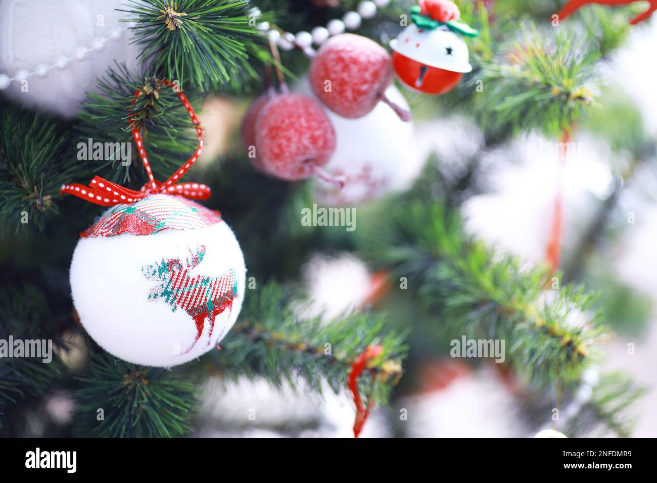 Christmas holiday background. Silver and red bauble hanging from a ...