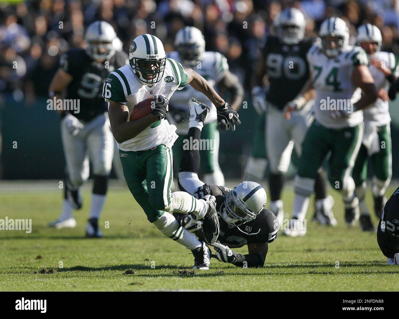 New York Jets wide receiver Brad Smith breaks a tackle by Oakland ...