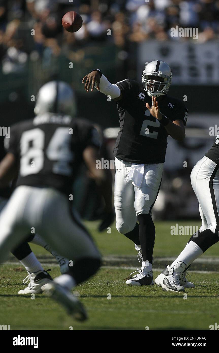Oakland Raiders quarterback JaMarcus Russell (2) passes to wide ...