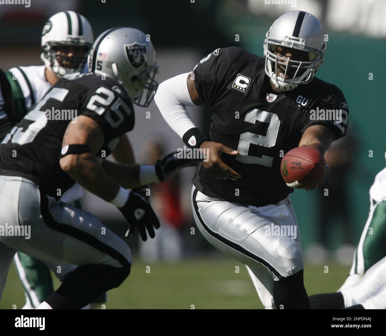 Oakland Raiders quarterback JaMarcus Russell (2) hands off to running ...