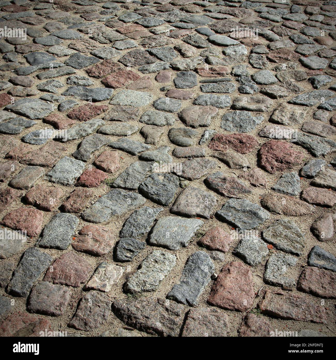 Cobblestone background texture. Cobbled square in Malbork castle ...