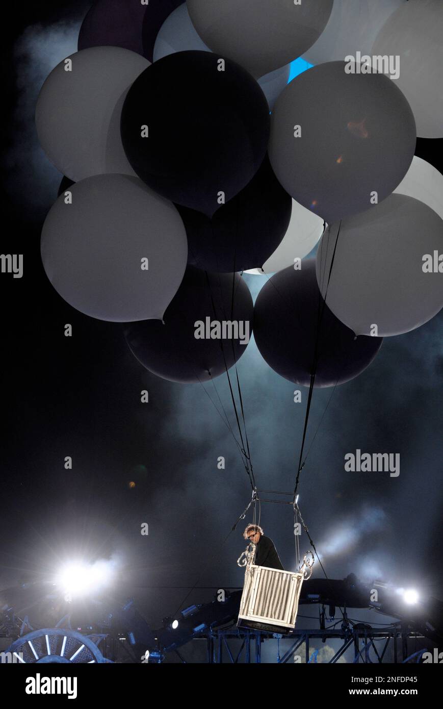 Director Tim Burton flies down to the stage via balloons during the ...