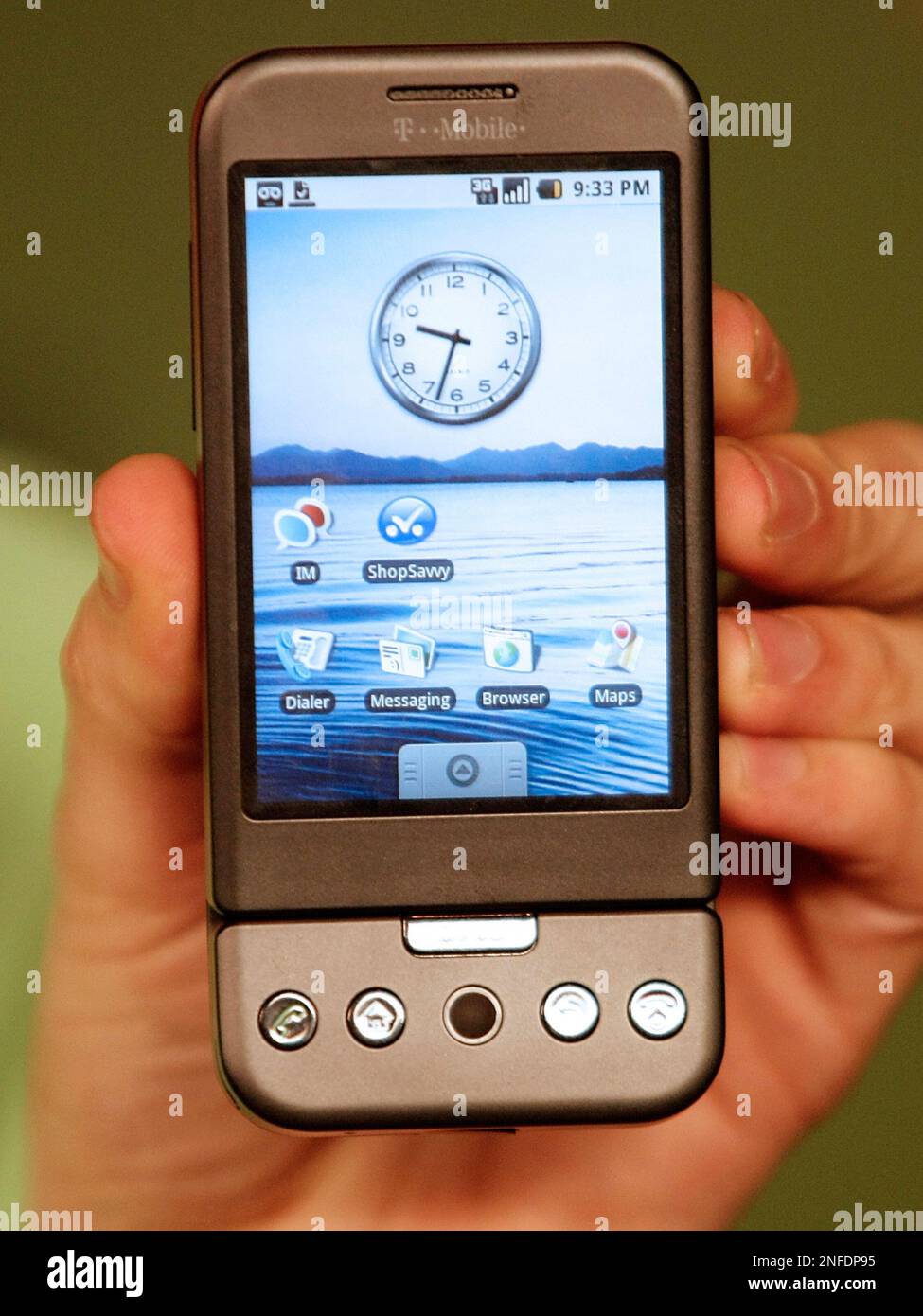 A model holds up the G1 phone at the T-Mobile G1 debut party in Los ...